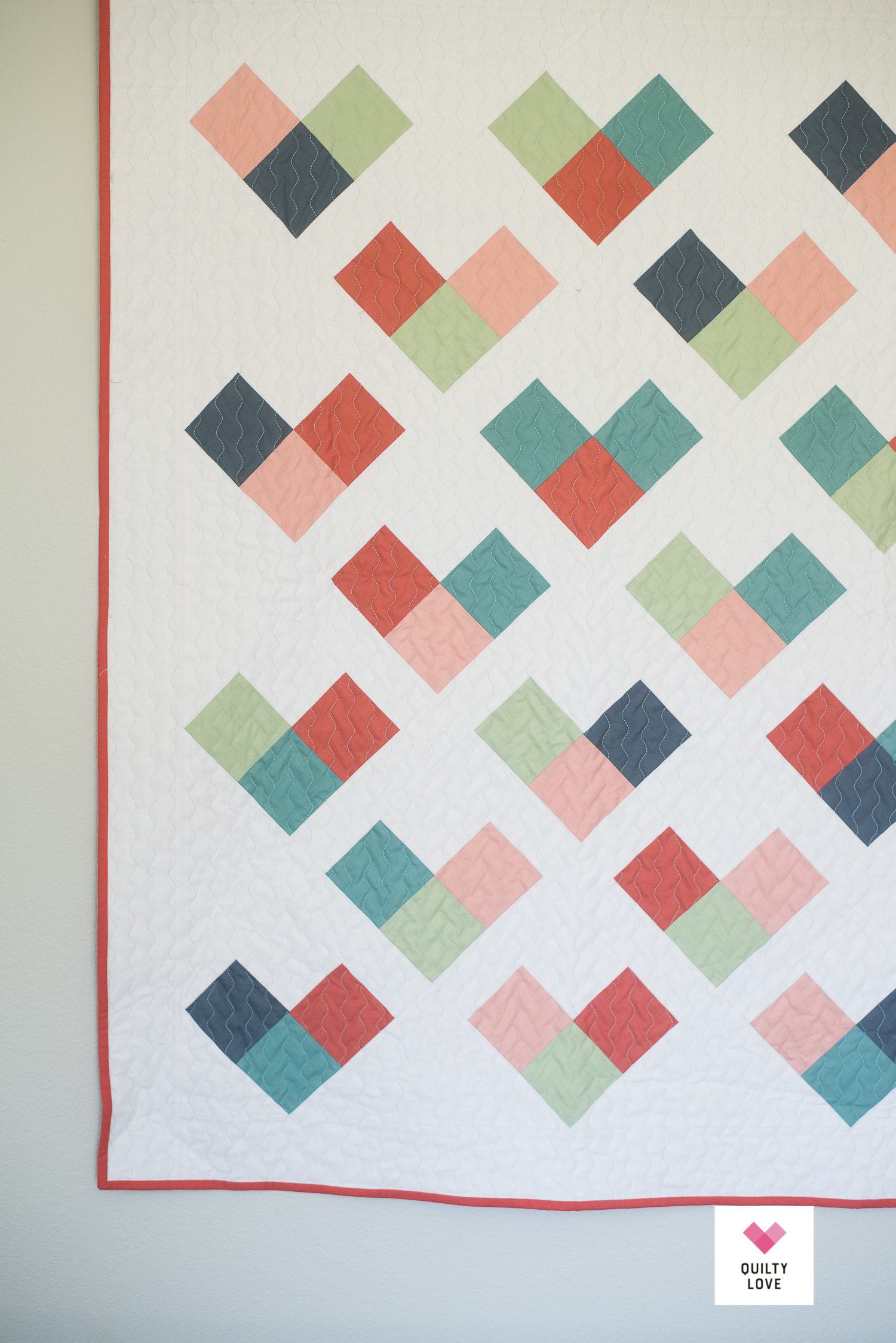 Quilty Hearts baby quilt pattern - The scrappy solids one - Quilty Love