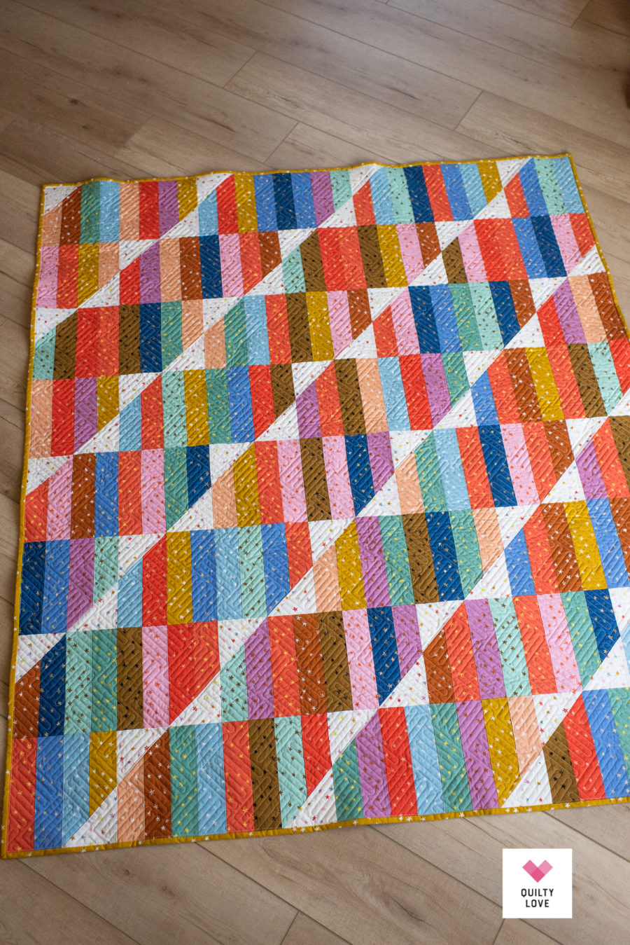 Happy Stripes quilt pattern - Starry Fabrics Stash Buster - Quilty Love