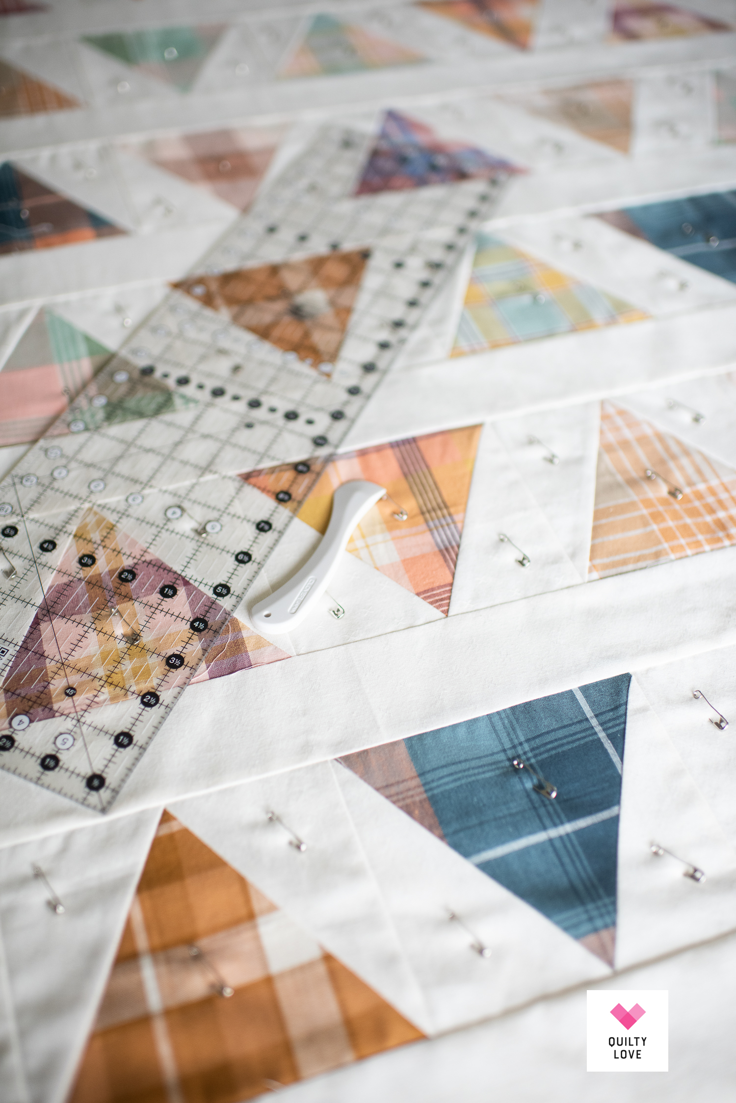 Fableism Arcade Plaid Triangle Pop baby quilt - Quilty Love