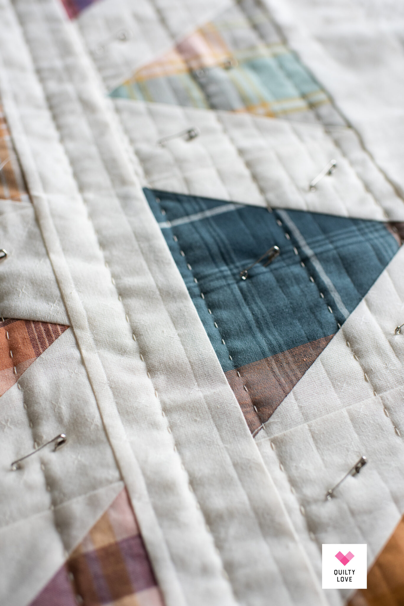 Fableism Arcade Plaid Triangle Pop baby quilt - Quilty Love