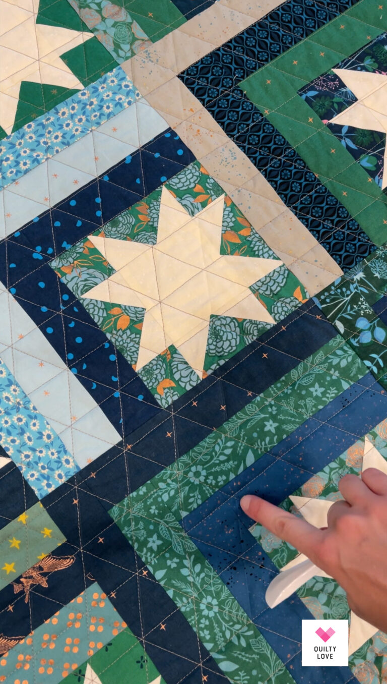 Scrappy Log Cabin Stars quilt - Quilty Love