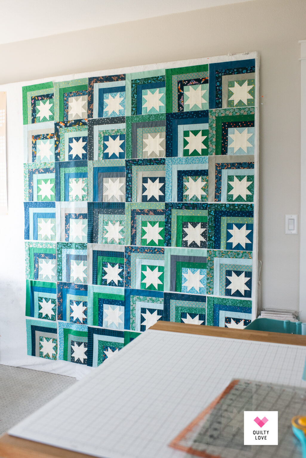 Scrappy Log Cabin Stars quilt - Quilty Love