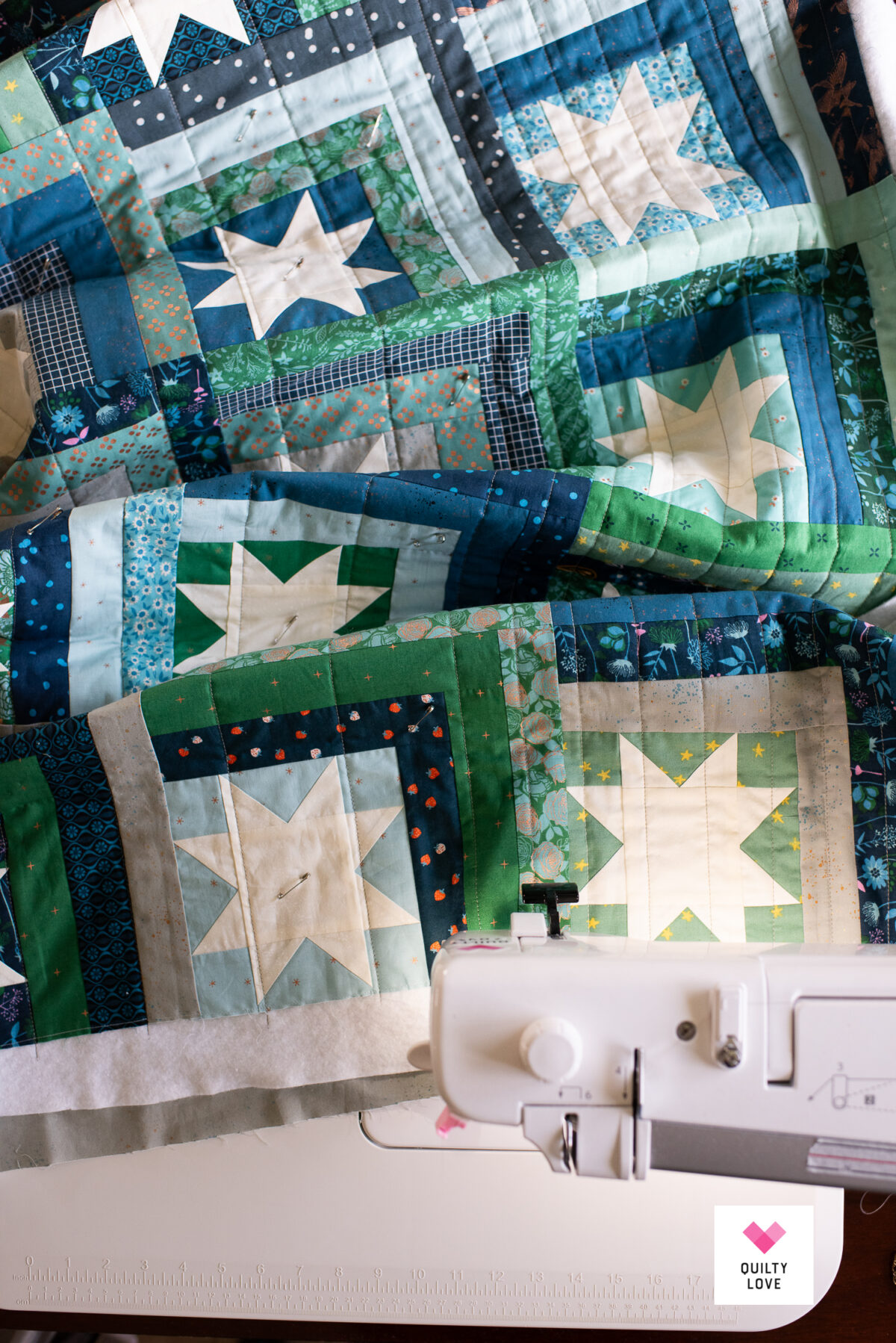 Scrappy Log Cabin Stars quilt - Quilty Love