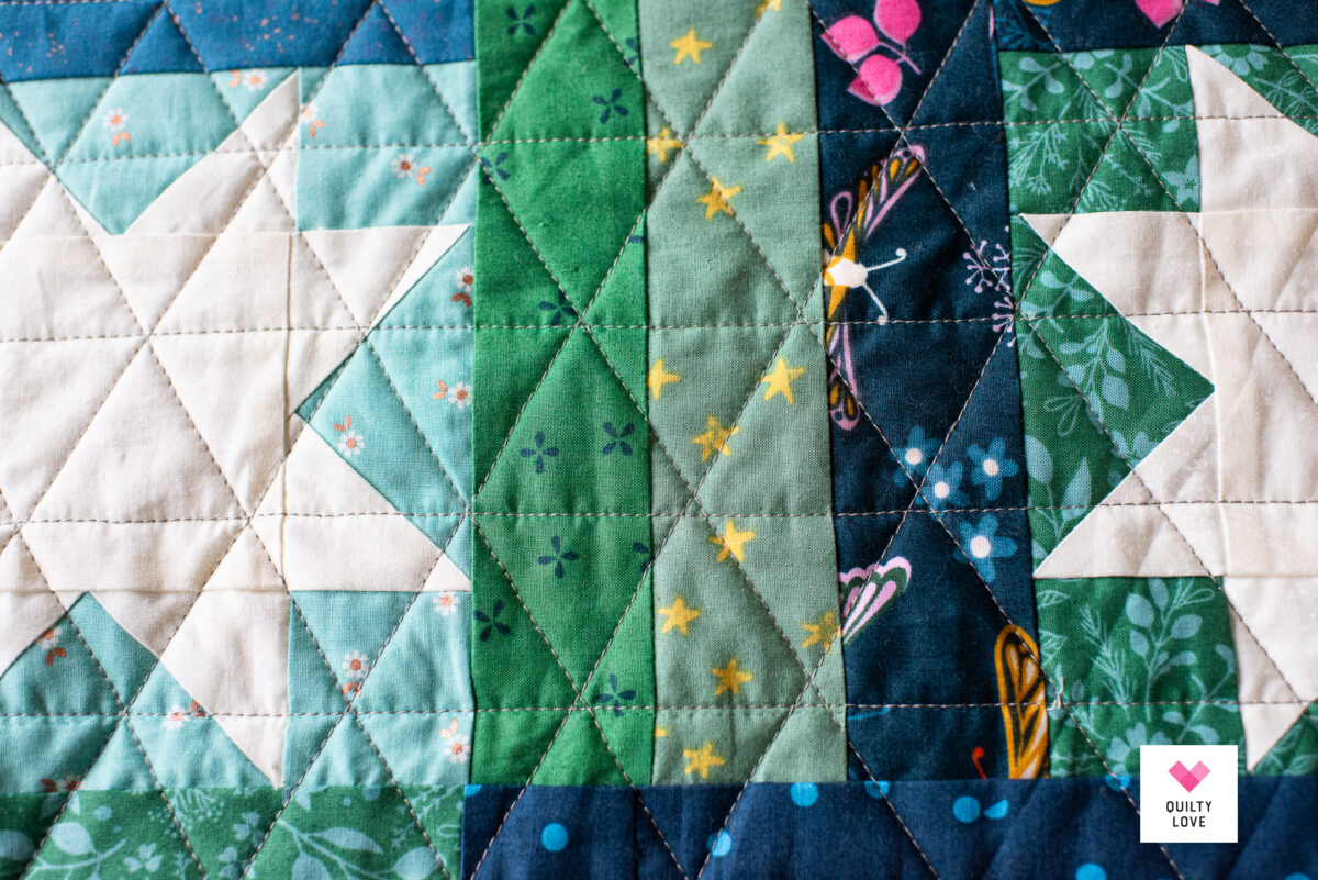 Scrappy Log Cabin Stars quilt - Quilty Love