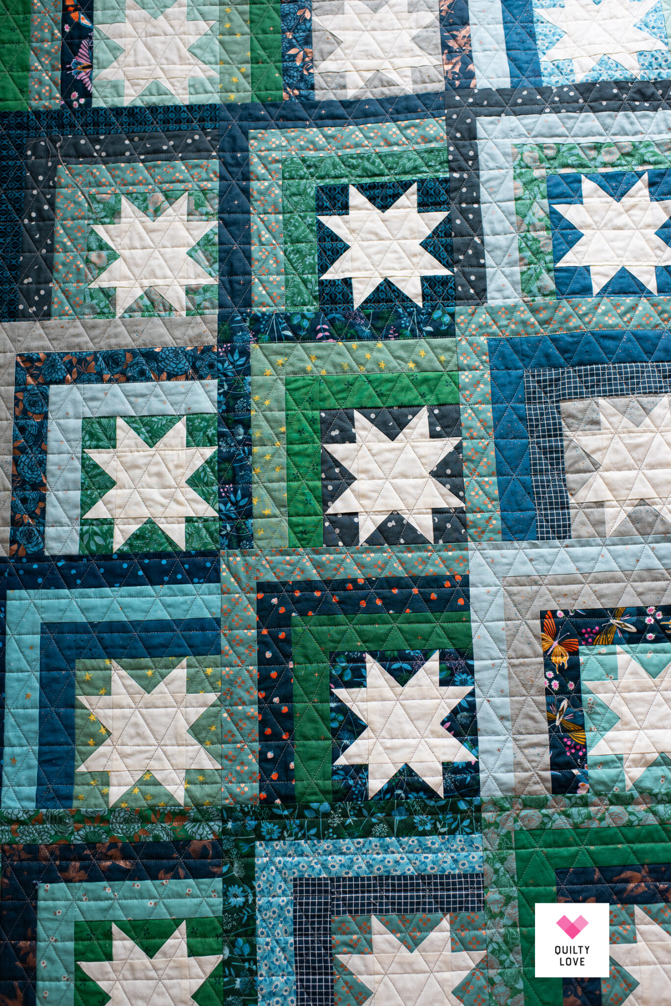 Scrappy Log Cabin Stars quilt - Quilty Love