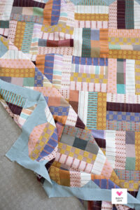 Happy Scallops quilt pattern - Quilty Love