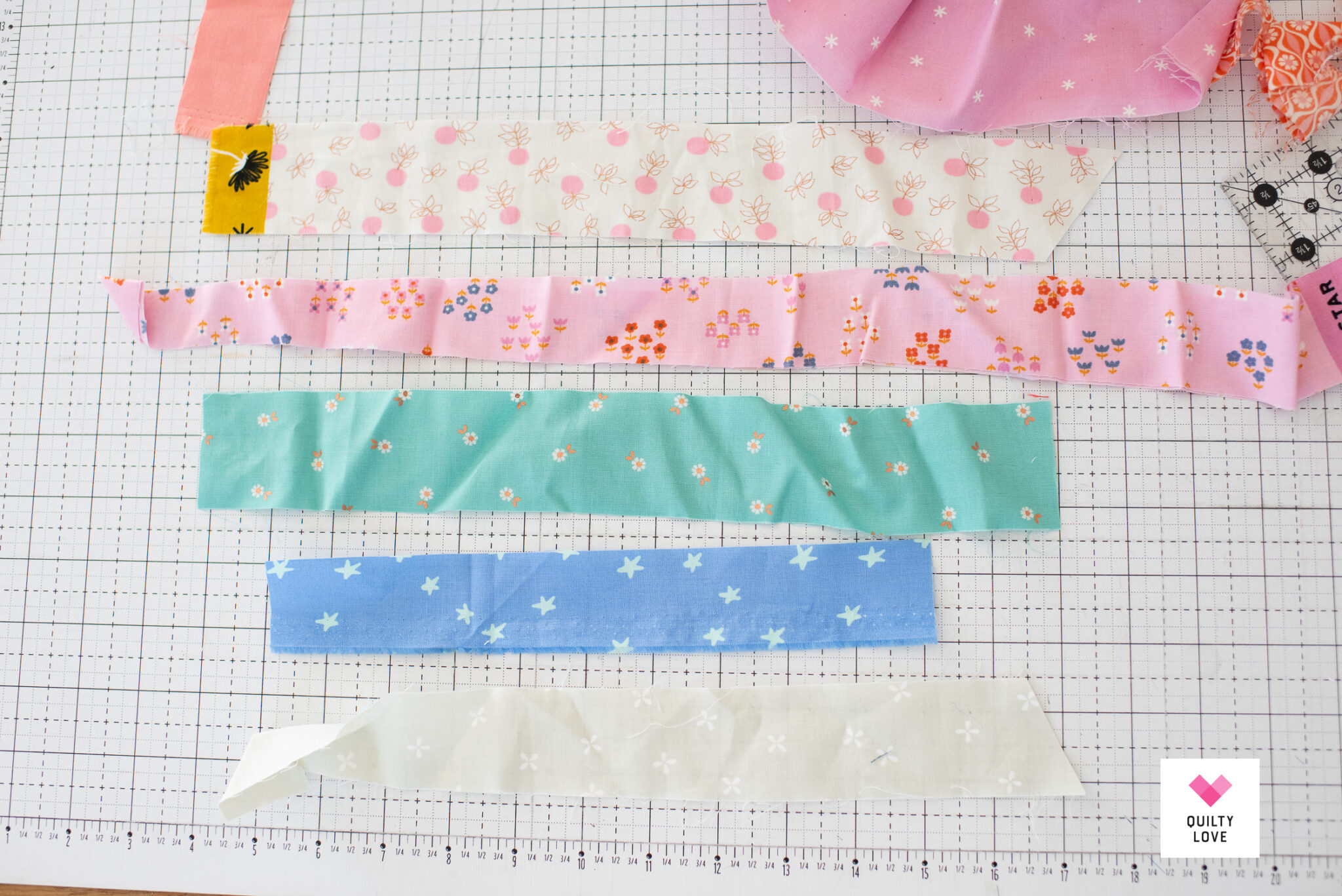 Pastel Scrappy String quilt - Quilty Love