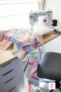 Pastel Scrappy String quilt - Quilty Love