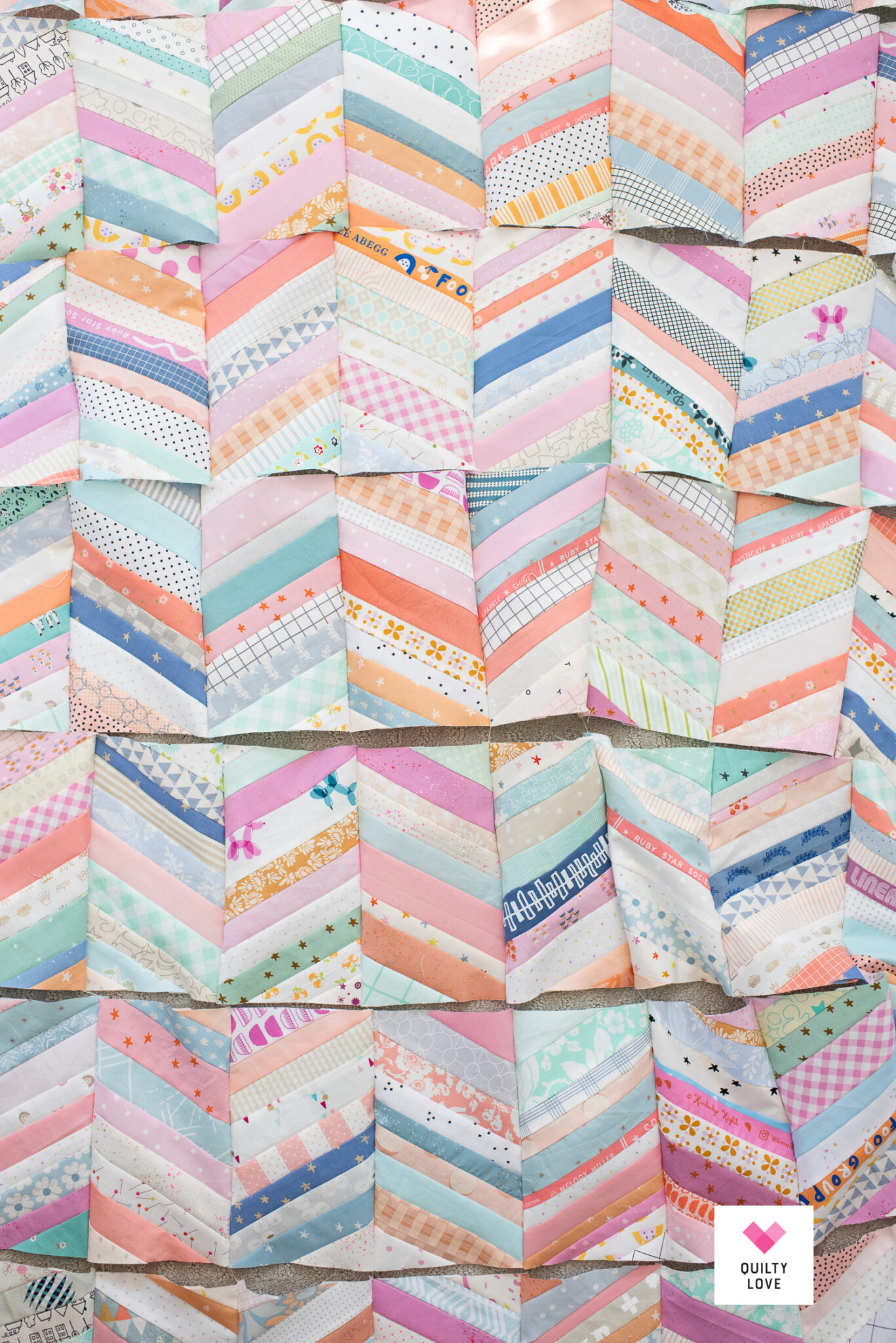 Pastel Scrappy String quilt - Quilty Love