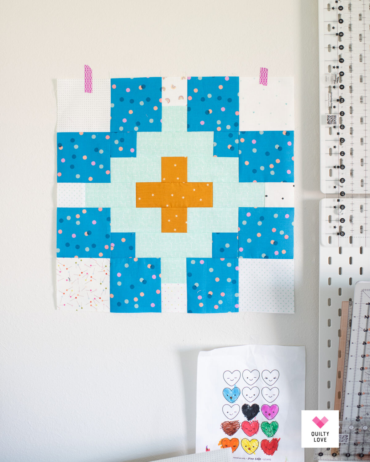 Scrappy Glowing quilt with scrappy low volume background - Quilty Love