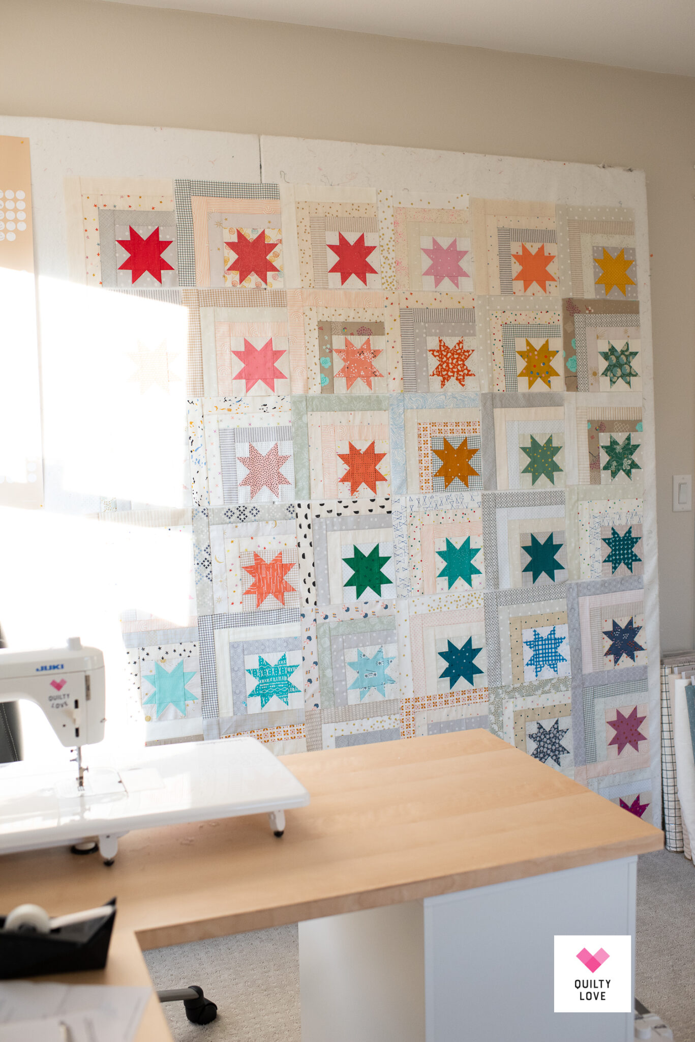 Rainbow Scrap Stash Log Cabin Stars quilt - Quilty Love