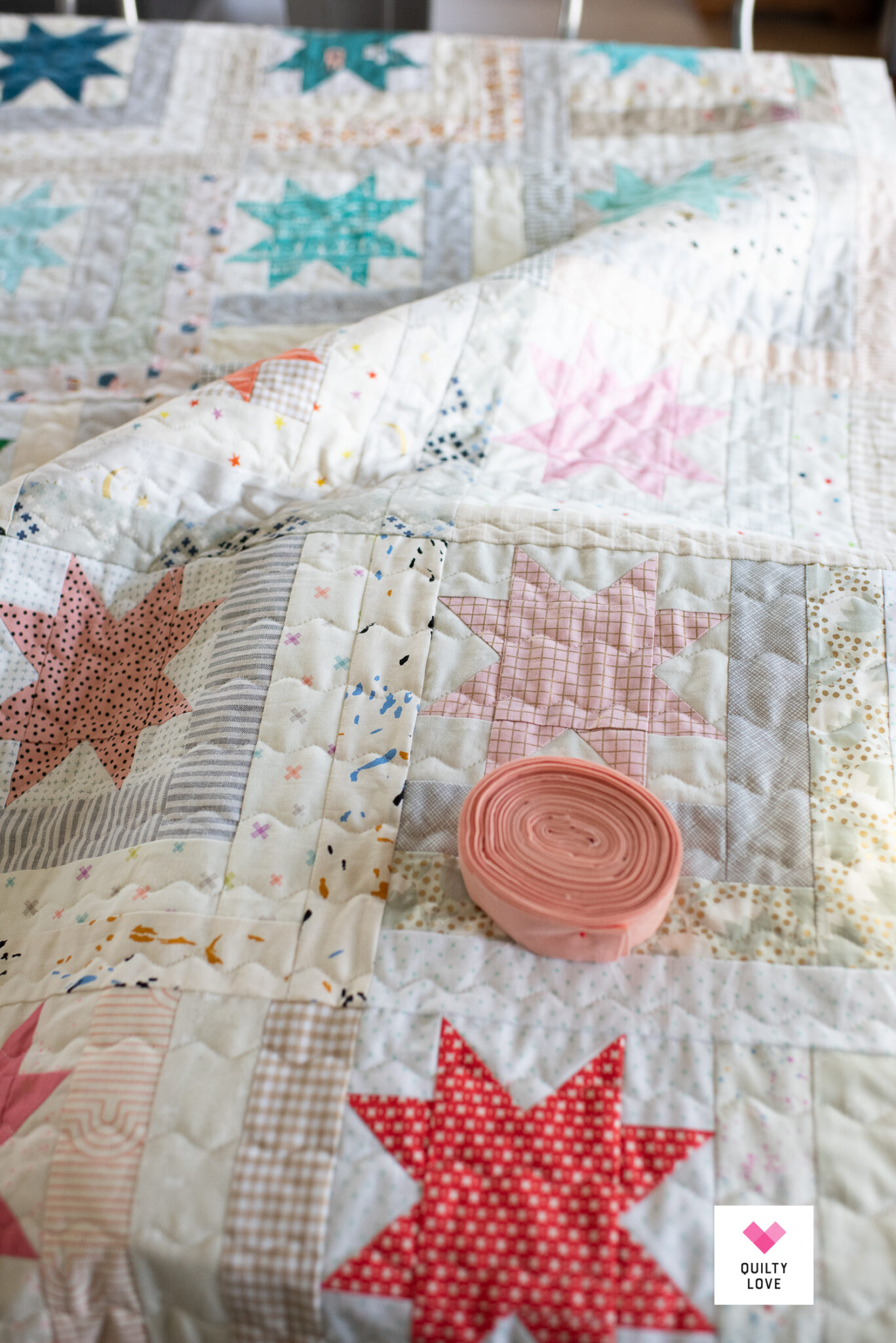 Rainbow Scrap Stash Log Cabin Stars quilt - Quilty Love