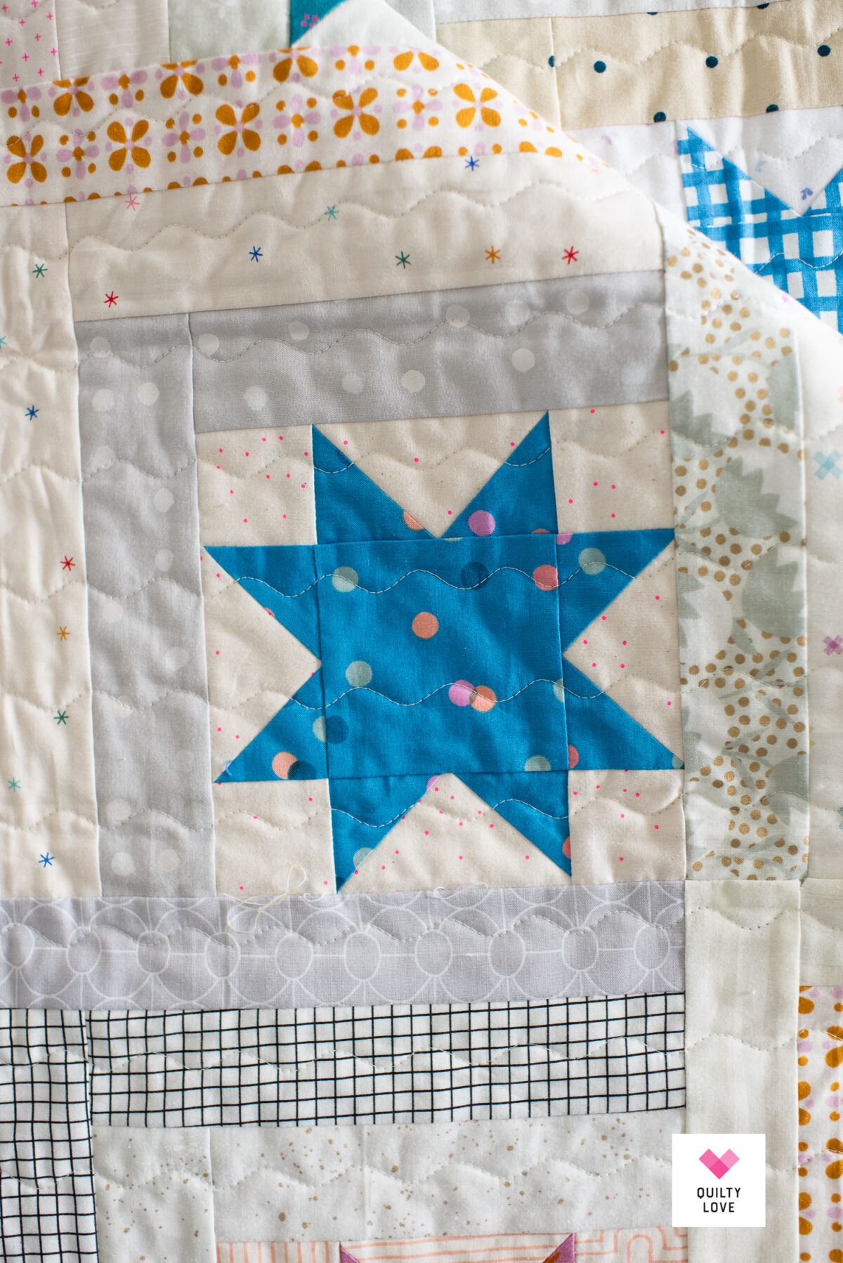 Rainbow Scrap Stash Log Cabin Stars quilt - Quilty Love