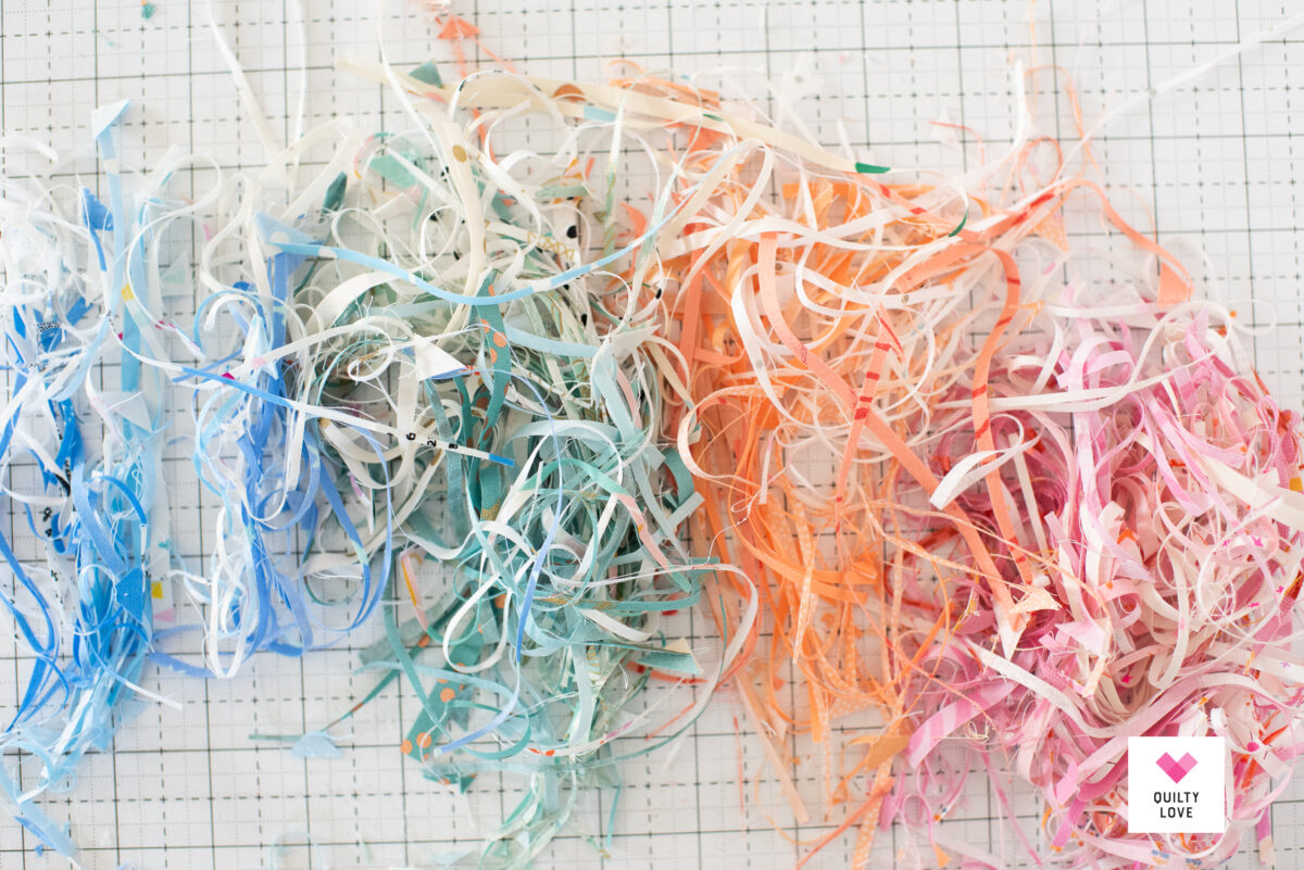 Scrappy Rainbow Patchwork Flying Geese quilt - Quilty Love