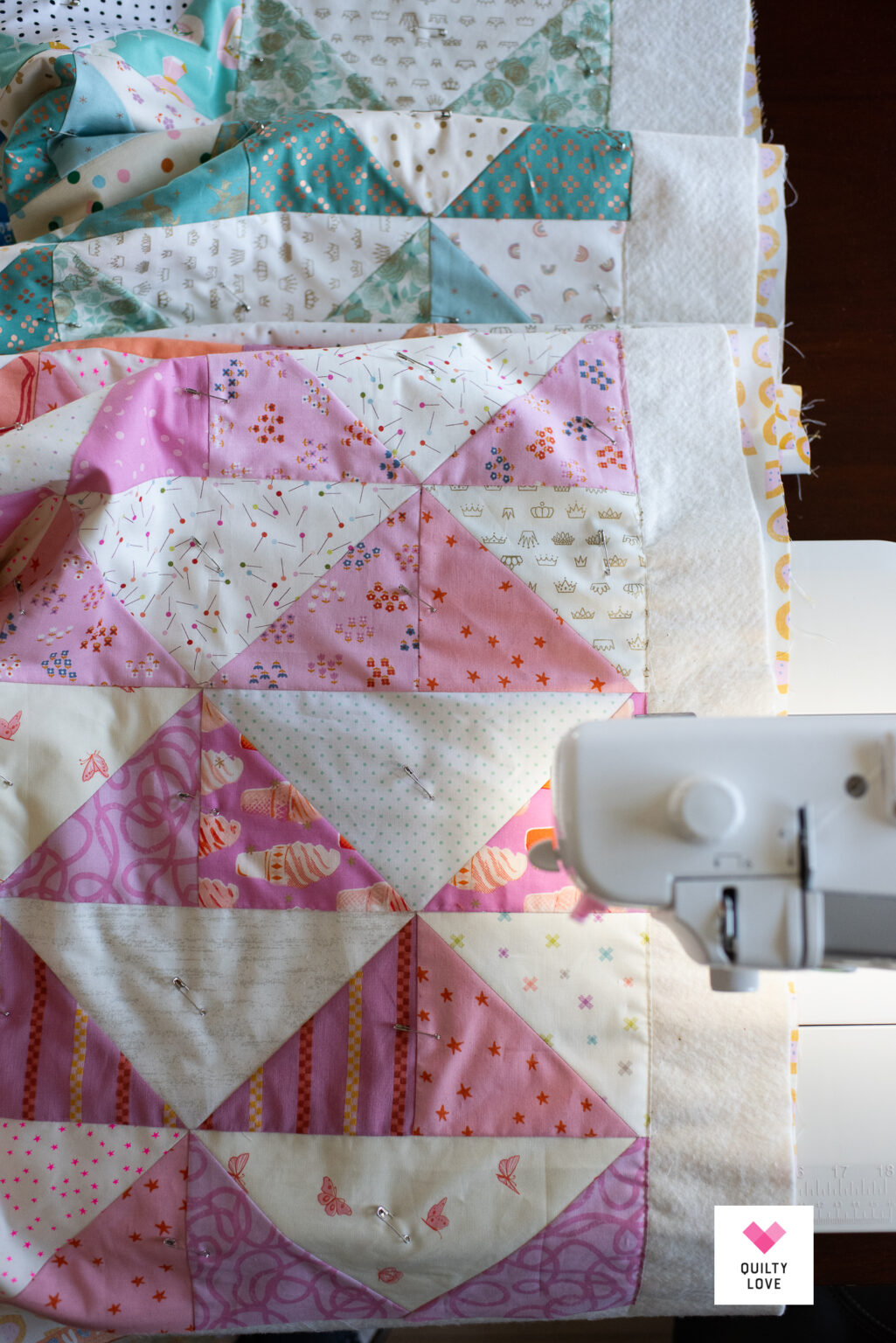 Scrappy Rainbow Patchwork Flying Geese quilt - Quilty Love