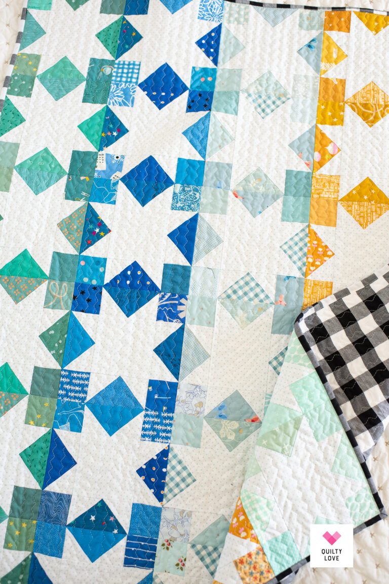 Scrappy Star Baby quilt - A scrap stash Star Fall quilt - Quilty Love