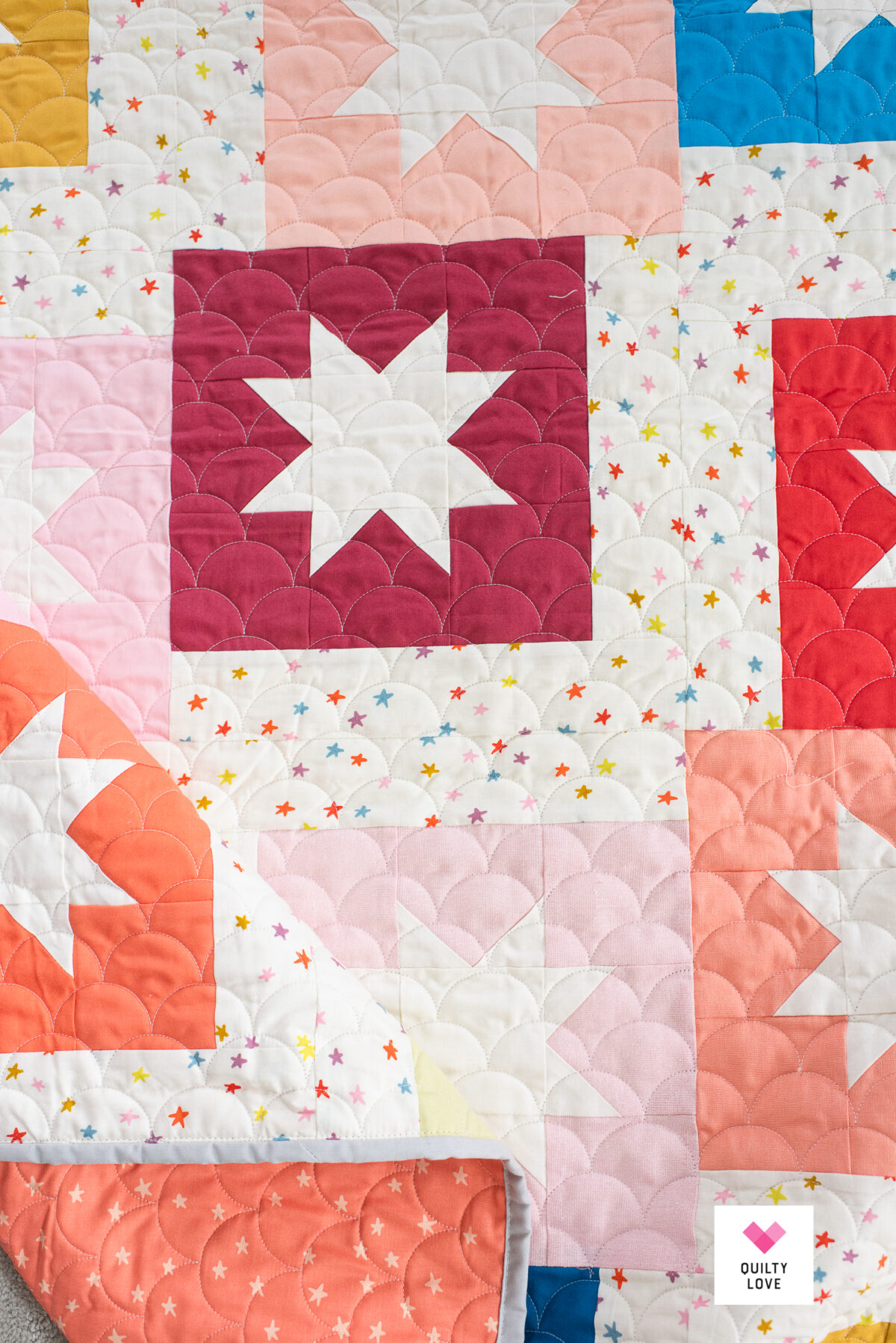 Stepping Stars quilt made with solids and Starry fabric - Quilty Love