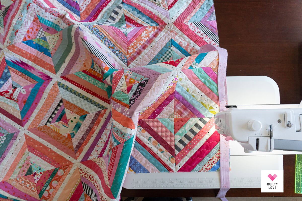 A Scrappy Pink String Quilt - Quilty Love